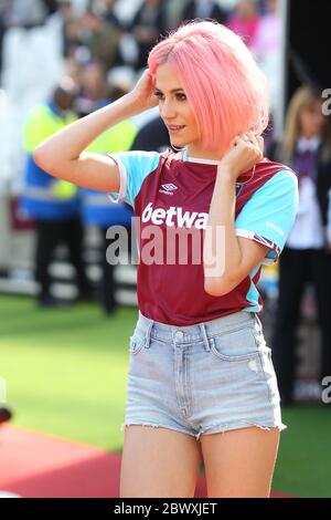 Pixie Lott stepped onto the football pitch at half time during West Ham ...