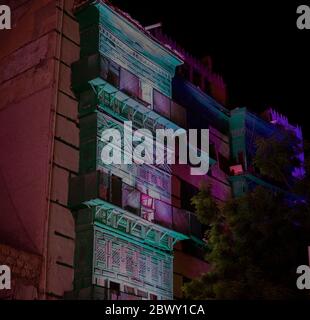 Ancient clay buildings and green landscape in a desert mountain village ...