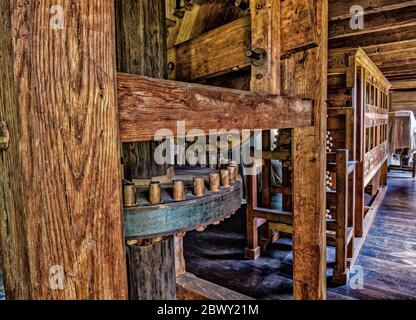 Inside the old wooden water mill set milling machine. Visible fences ...