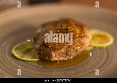 Lime fillet gourmet recipe resting on a restaurant table, no people are ...