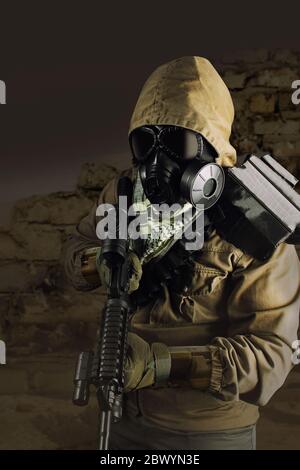 post-apocalyptic warrior in gas mask with machine gun isolated on white ...