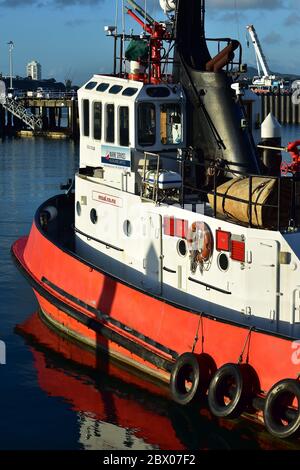 detail of stern of tug boat showing rubber bumpers, winch, dolphins and ...