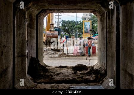 Concrete drainage pipes at the construction site. Laying of underground ...