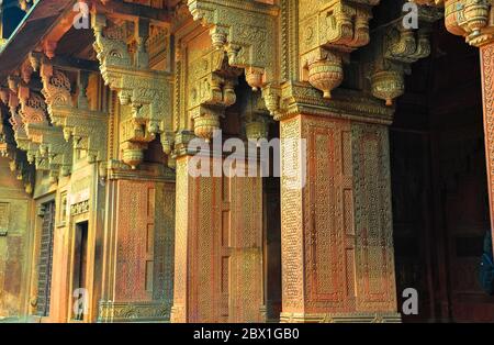 Detail of the intricately carved red sandstone arched entrance with ...