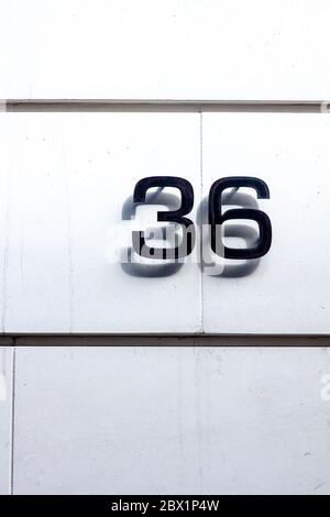 Black house number 36 Stock Photo - Alamy