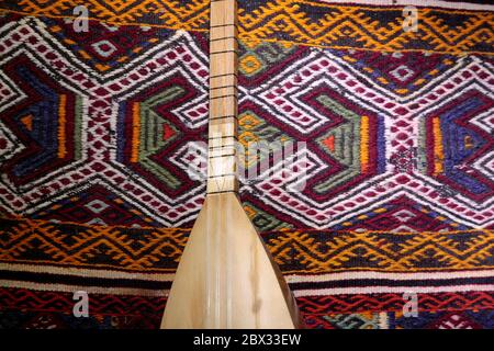 Turkish instrument on the rug. Saz Baglama Stock Photo - Alamy