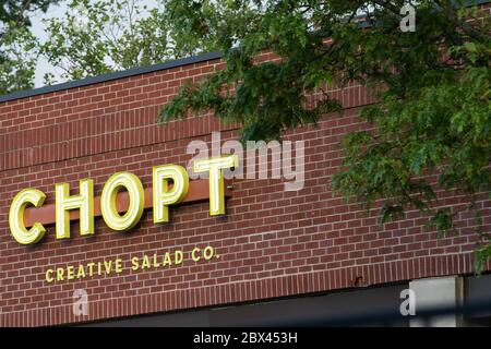 A logo sign outside of a Chopt Creative Salad Company restaurant ...