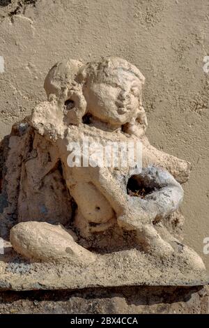 Woman playing veena musical instrument carved in stone on the wall of ...