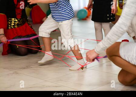 Kids Jumping over Rope Stock Photo - Alamy