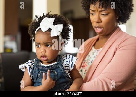 African American mother disciplining parenting her young child Stock ...