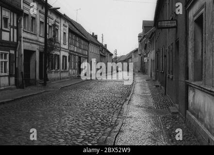 Brandenburg / GDR / early 1990 Jueterbog, old town, middle street. In ...