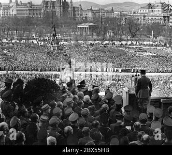 Adolf Hitler announces the annexation of Austria to the German Reich on ...