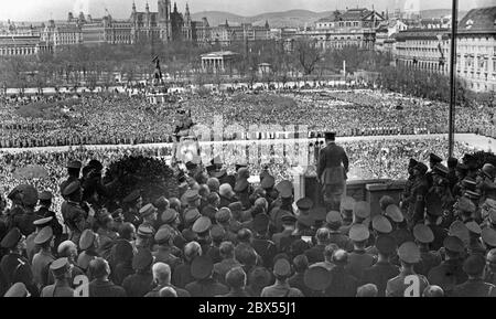 Adolf Hitler announces the annexation of Austria to the German Reich on ...