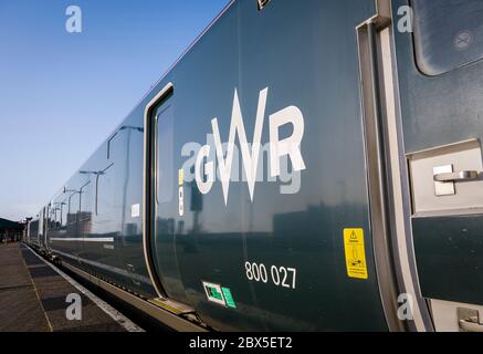 Azuma passenger train in GWR livery leaving Swansea railway station ...