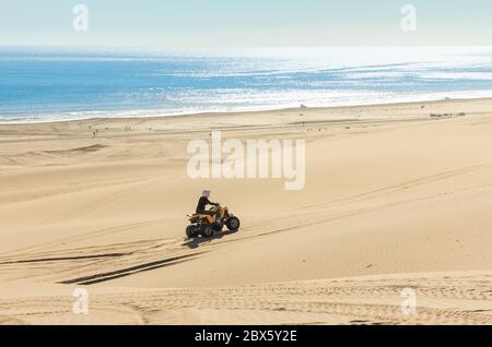 Swakopmund, Namibia, landscape, 4x4 ATV buggy racing up sand dune ...