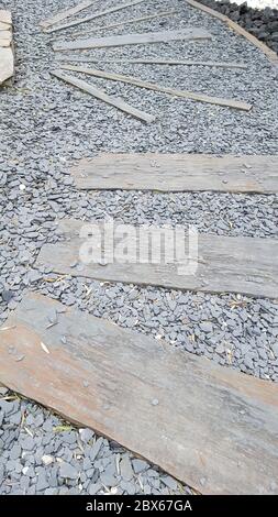 Decorative slate stone paving of path RHS Gardens Royal Horticultural Society garden Rosemoor ...