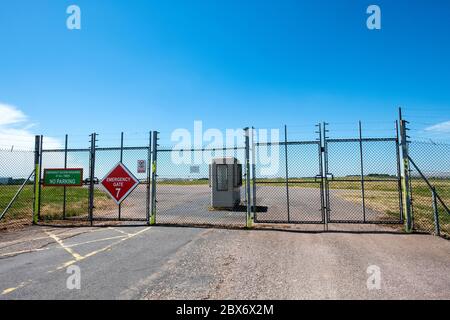 Emergency crash gate at airport runway red diamond warning sign. Gates ...