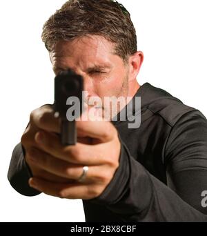 serious young hitman pointing and aiming his gun to the camera on white ...