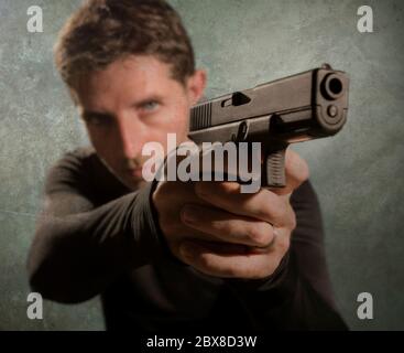 grunge cinematic portrait of attractive and dangerous looking hitman or ...