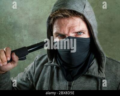 young man as ultra and radical anarchist rioter . furious antifa ...