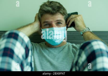 virus outbreak - dramatic portrait of sick man in medical facial mask ...