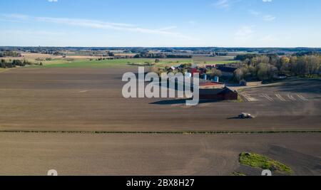 tractor - aerial view of a tractor at work - cultivating a field in ...