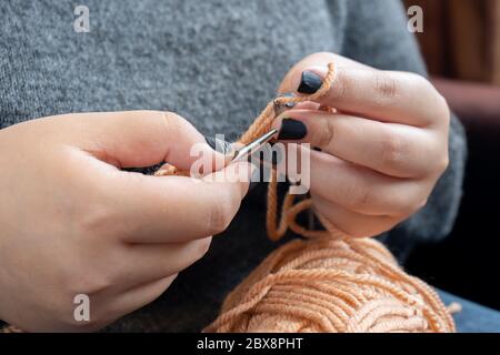 Women's hands knit from color wool. Hand knitting Stock Photo - Alamy