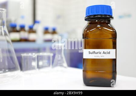 Sulphuric acid, laboratory bottle. The hazard label warns that this ...