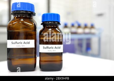 Sulphuric acid, laboratory bottle. The hazard label warns that this ...