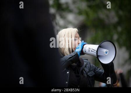Actress, Imarn Ayton, speaking in to a tannoy loudspeaker and ...