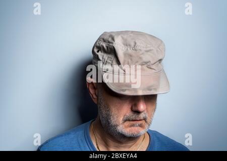 a look hidden under the cap Stock Photo - Alamy