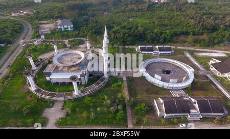 Aerial view of Al Abrar Mosque with forest background in the month of ...