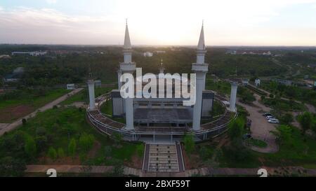 Aerial view of Al Abrar Mosque with forest background in the month of ...