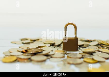 Coin money and lock, on gray background. Saving and financial security ...