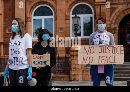 MERTHYR TYDFIL, UK. 07th June, 2020. Protesters talk in front of the ...