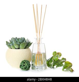 Herbal reed diffuser on white background Stock Photo - Alamy