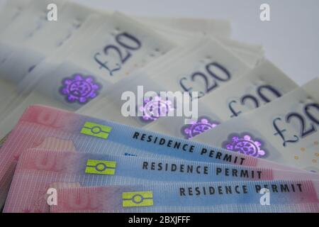 UK Biometric Residence permit cards and 20 pound banknotes. BRP cards ...