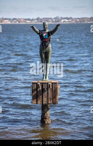 Eliza sculpture in the Swan River at dawn. The bronze sculpture depicts ...