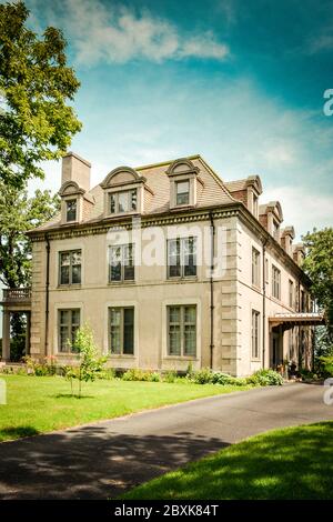 Three dormers with mansard windows in a roof structure covered with red ...