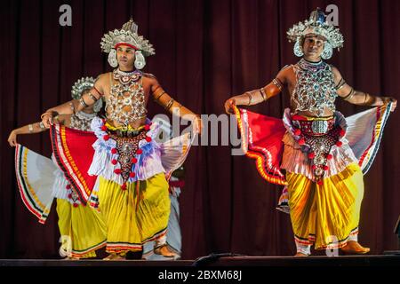 Kandyan dancers in costumes performing on stage in Kandy, Sri Lanka ...
