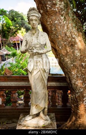 Dewi Sri or Shridevi the rice goddess. Stone figure of one of balinese ...