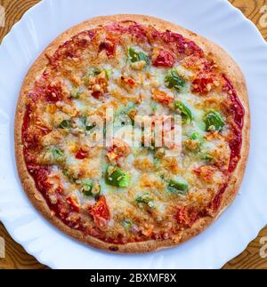 A top view of cheesy chicken pizza with sliced red bell pepper Stock ...