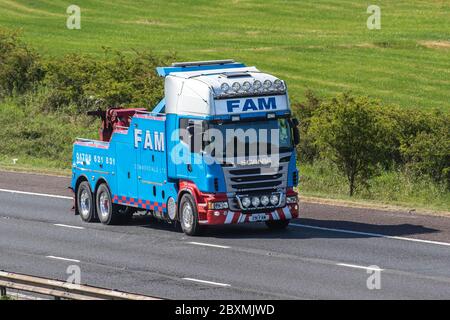 Heavy hgv Scania breakdown rescue tow truck moving a white Veolia ...