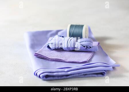 Everything for sewing. Beige fabric, sewing accessories and scissors ...