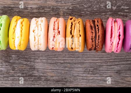 Tasty colorful French macaroons over bamboo background Stock Photo - Alamy