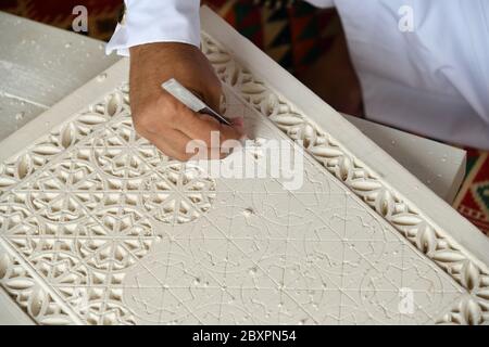 Hand of an arabian male gypsum carver close up. Qatar Stock Photo - Alamy