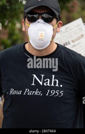 Protestors wearing face mask during a rally on the occasion of the ...