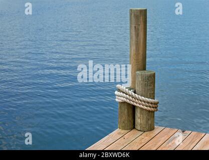 rope wrapped around a dock piling Stock Photo - Alamy