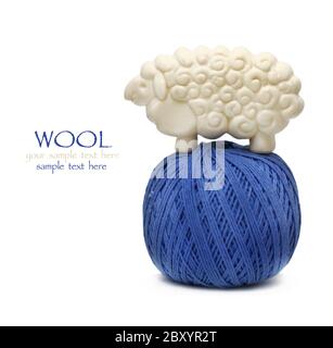 Blue ball of woollen thread isolated on white with lamb figure soap on ...