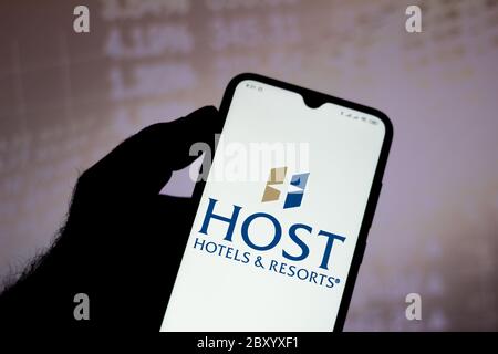 In this photo illustration, the Host Hotels and Resorts company logo is ...